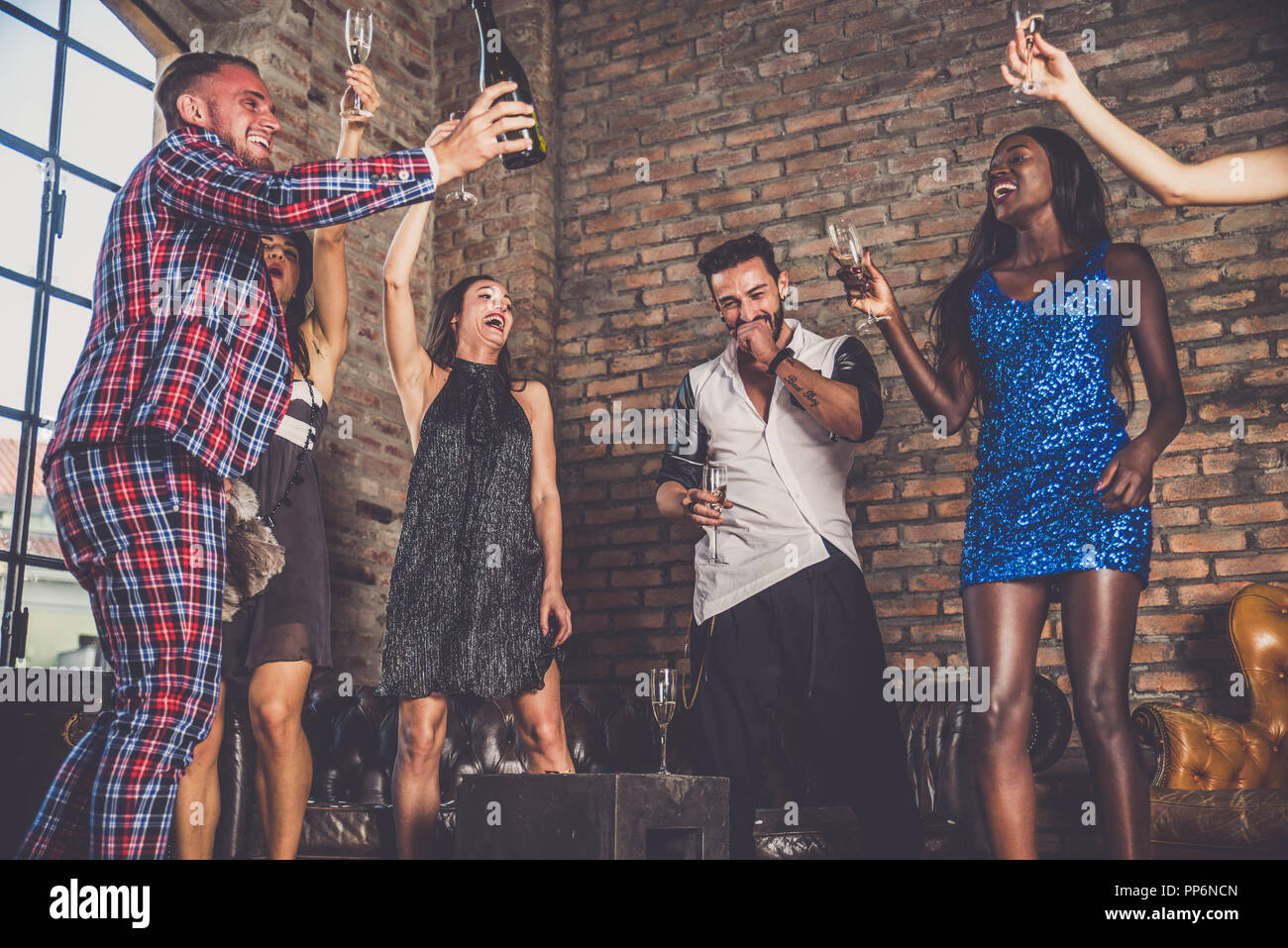 Multicultural group of friends having party - Happy people having fun ...