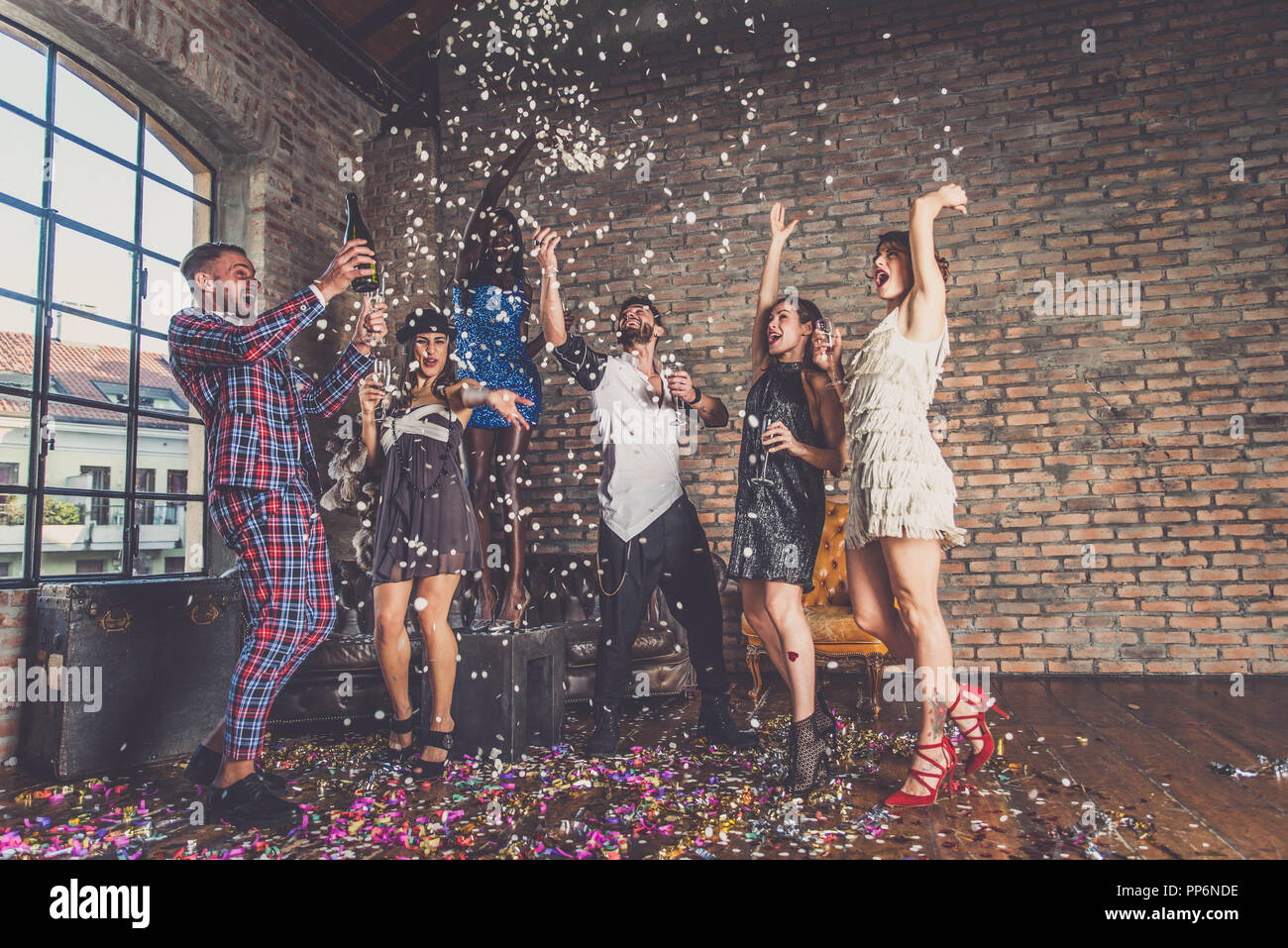Multicultural group of friends having party - Happy people having fun ...