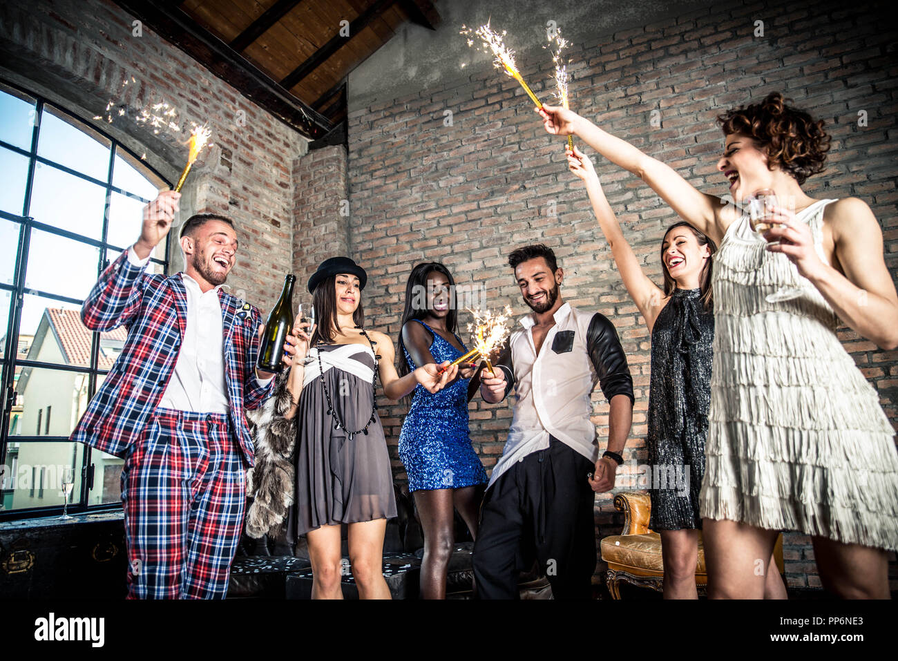 Multicultural group of friends having party - Happy people having fun ...