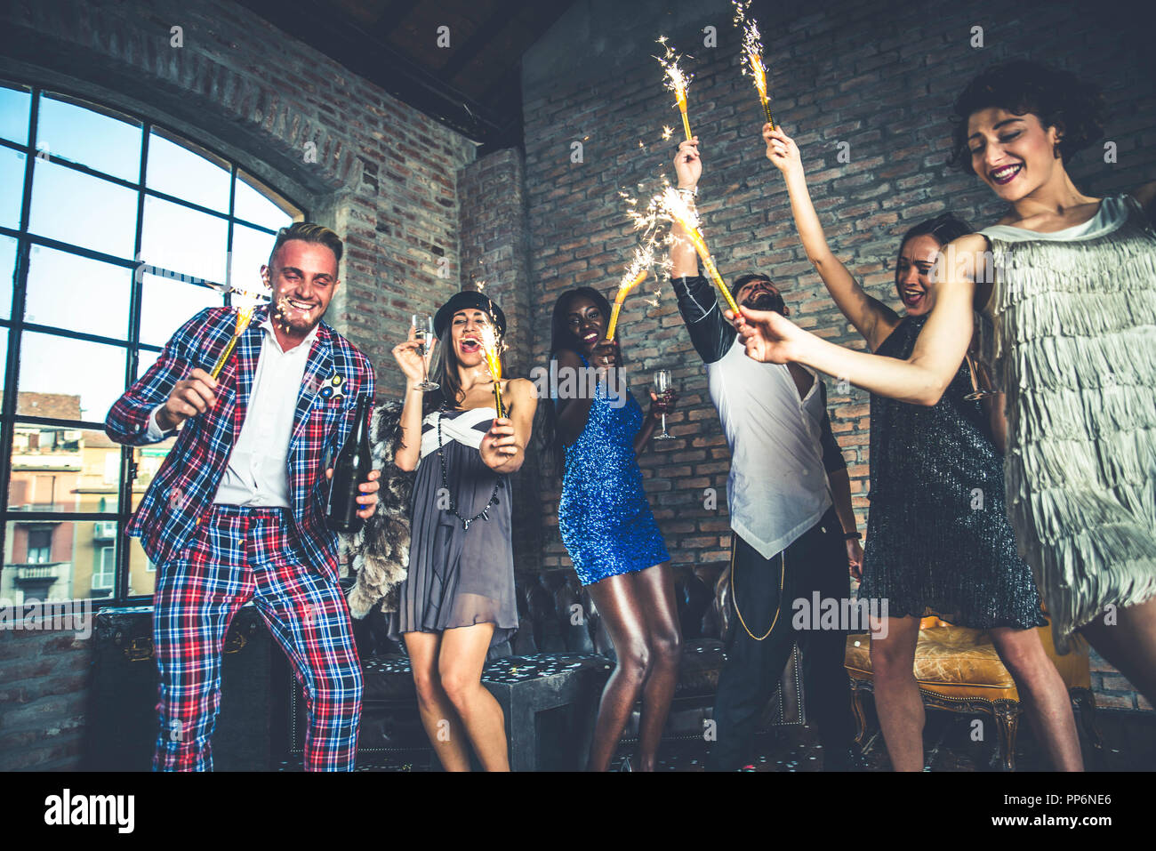 Multicultural group of friends having party - Happy people having fun ...