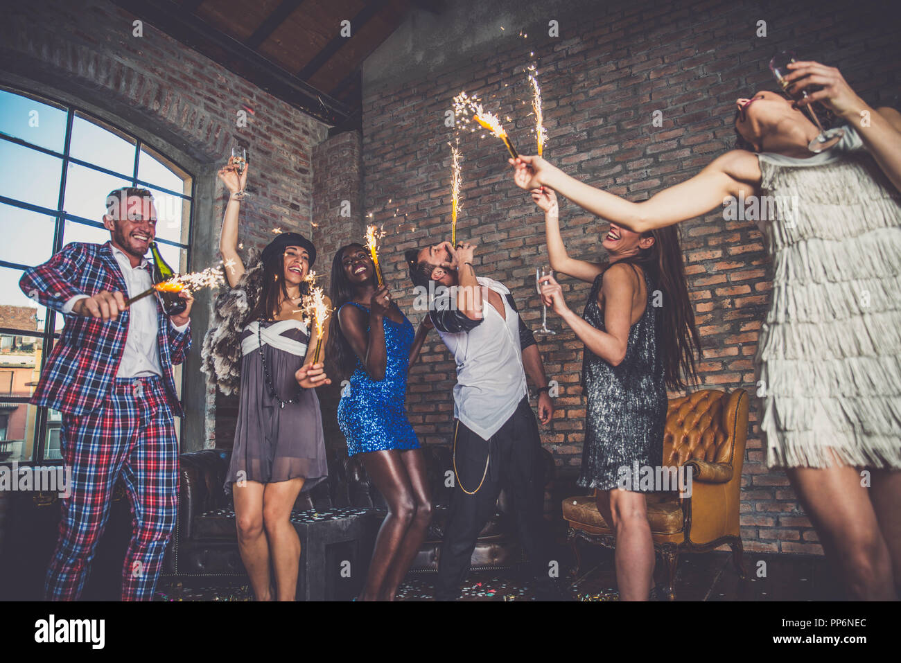 Multicultural group of friends having party - Happy people having fun ...