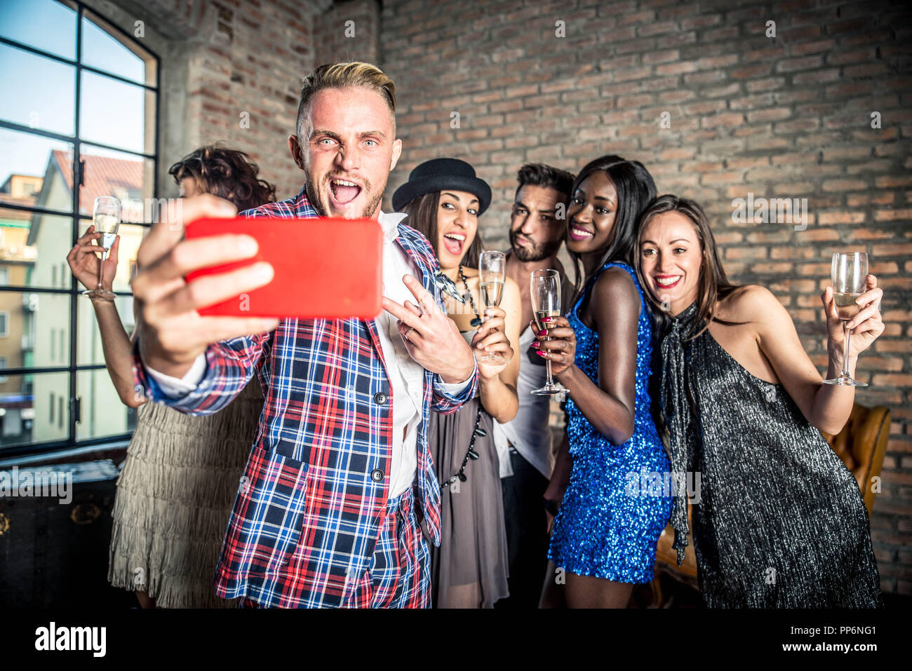 Multicultural group of friends having party - Happy people having fun ...