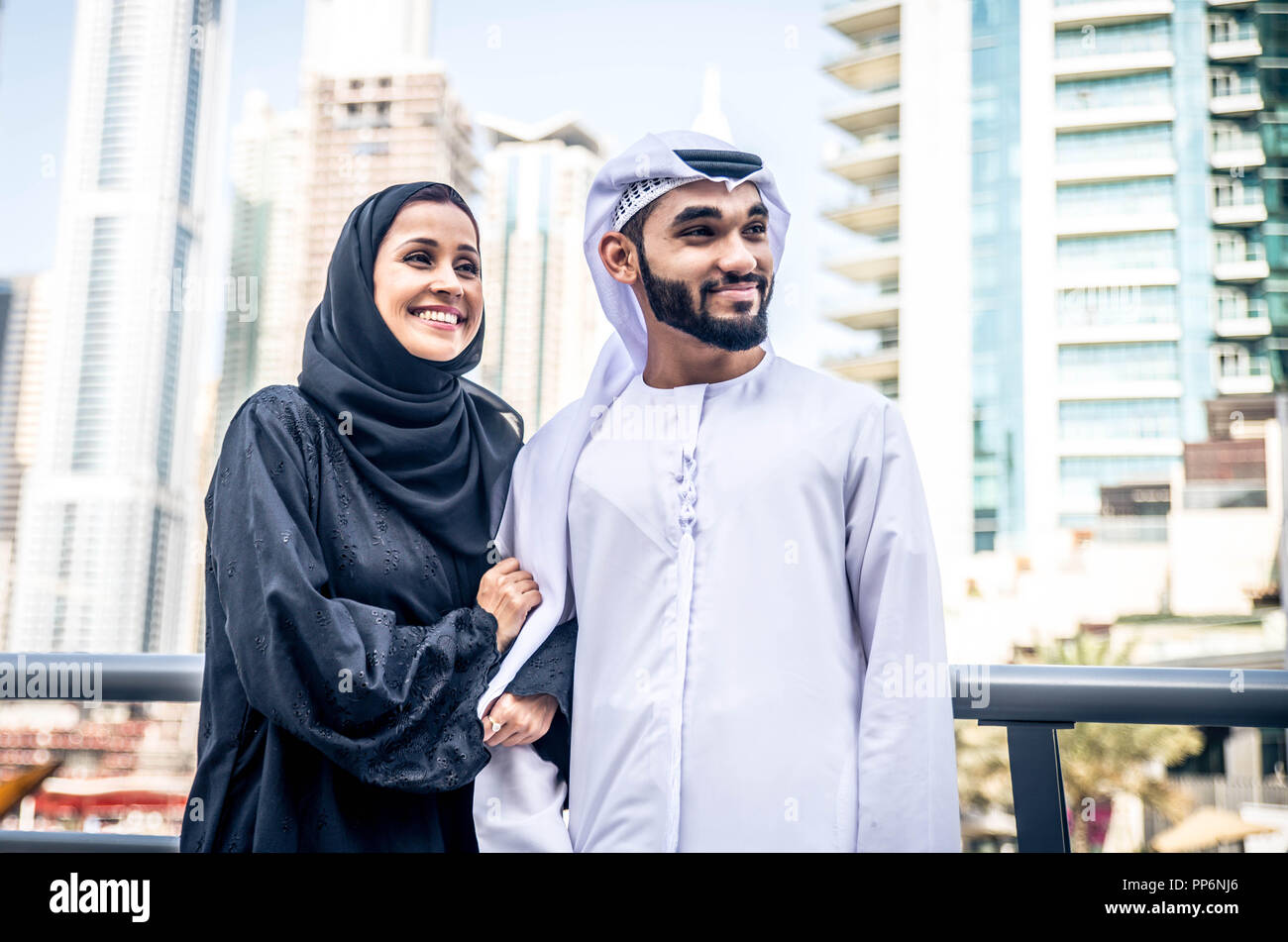 Arabic couple with traditional clothes dating outdoors Stock Photo - Alamy
