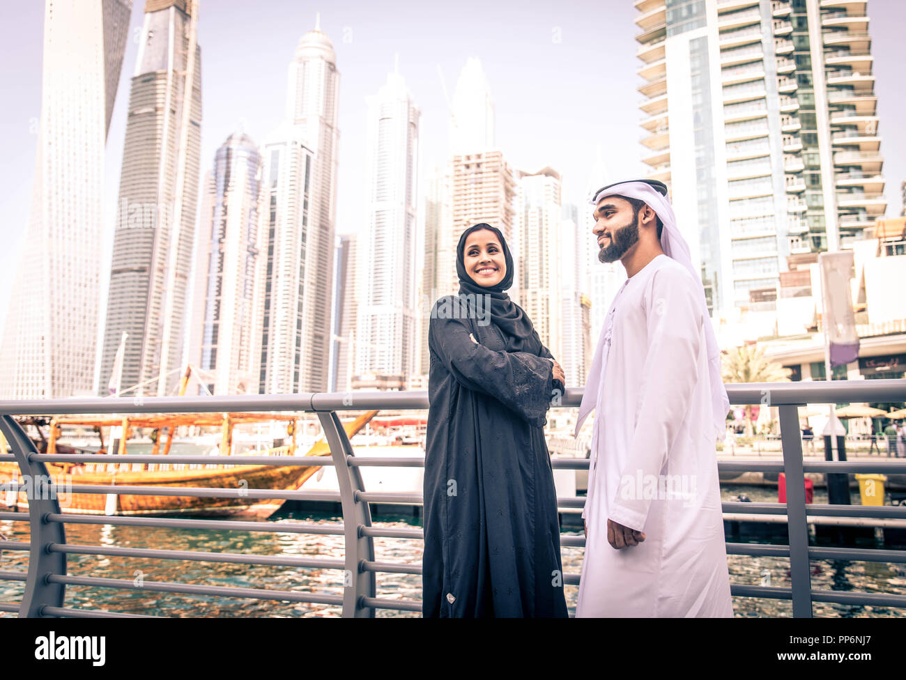 Arabic couple with traditional clothes dating outdoors Stock Photo - Alamy