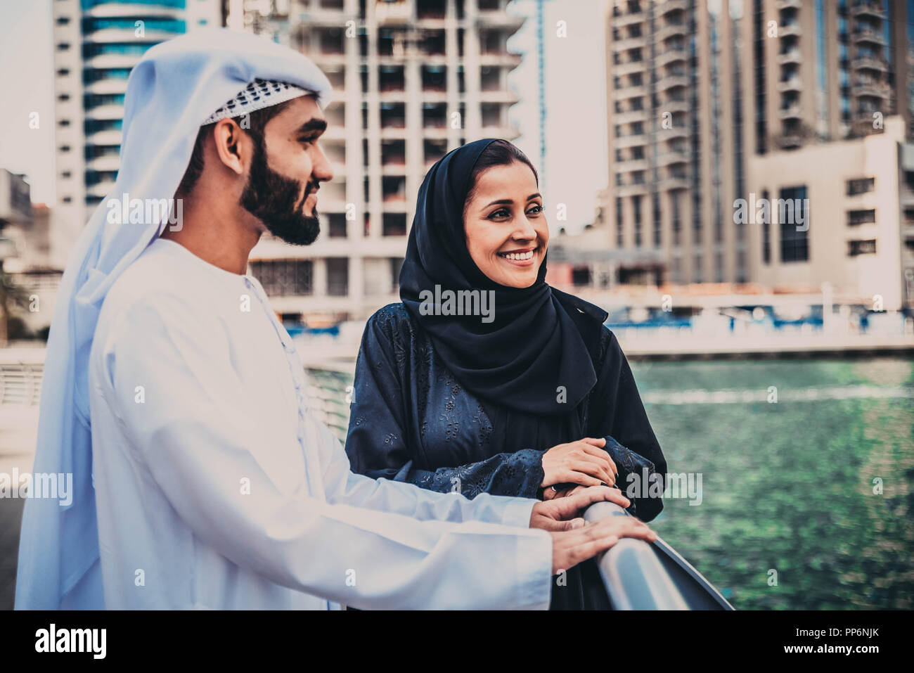 Arabic couple with traditional clothes dating outdoors Stock Photo - Alamy
