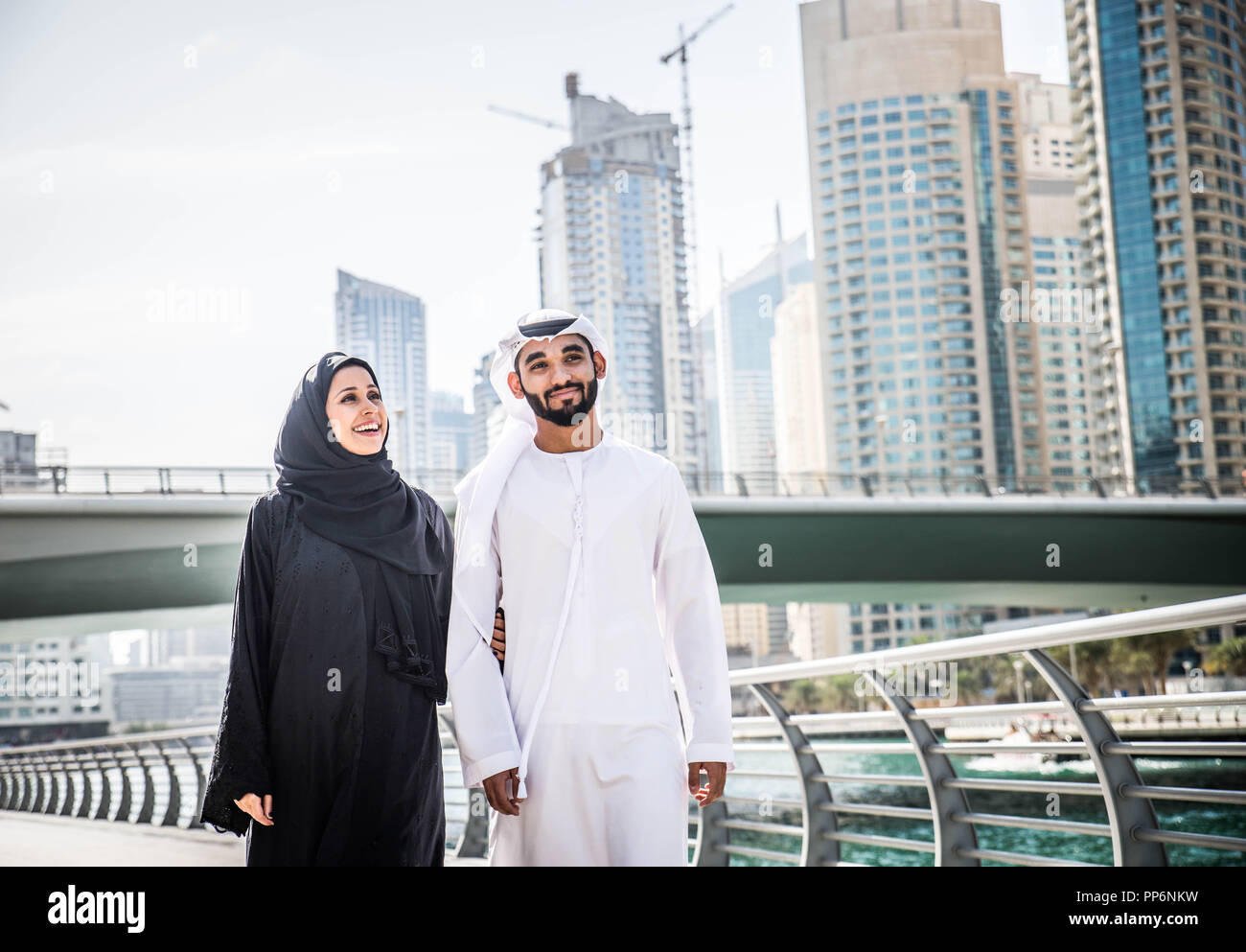 Arabic couple with traditional clothes dating outdoors Stock Photo - Alamy