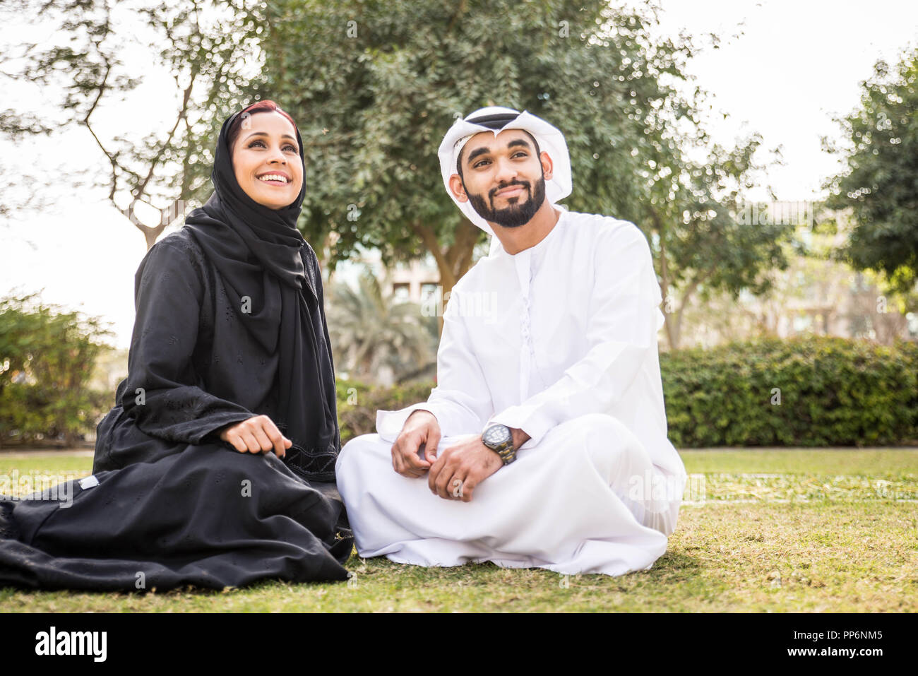 Arabic couple with traditional clothes dating outdoors Stock Photo - Alamy