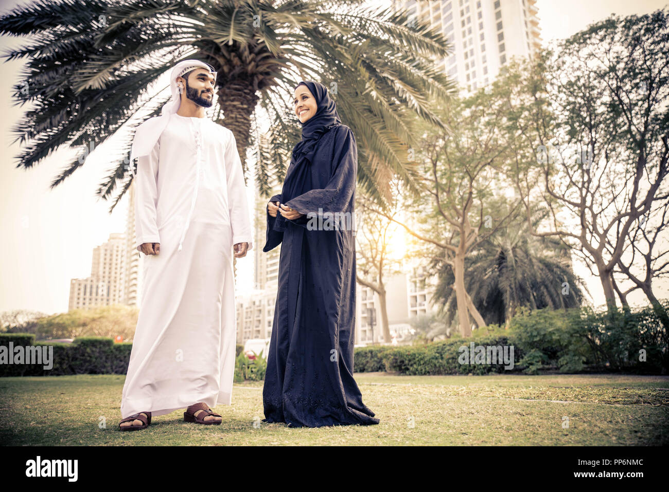 Arabic couple with traditional clothes dating outdoors Stock Photo - Alamy