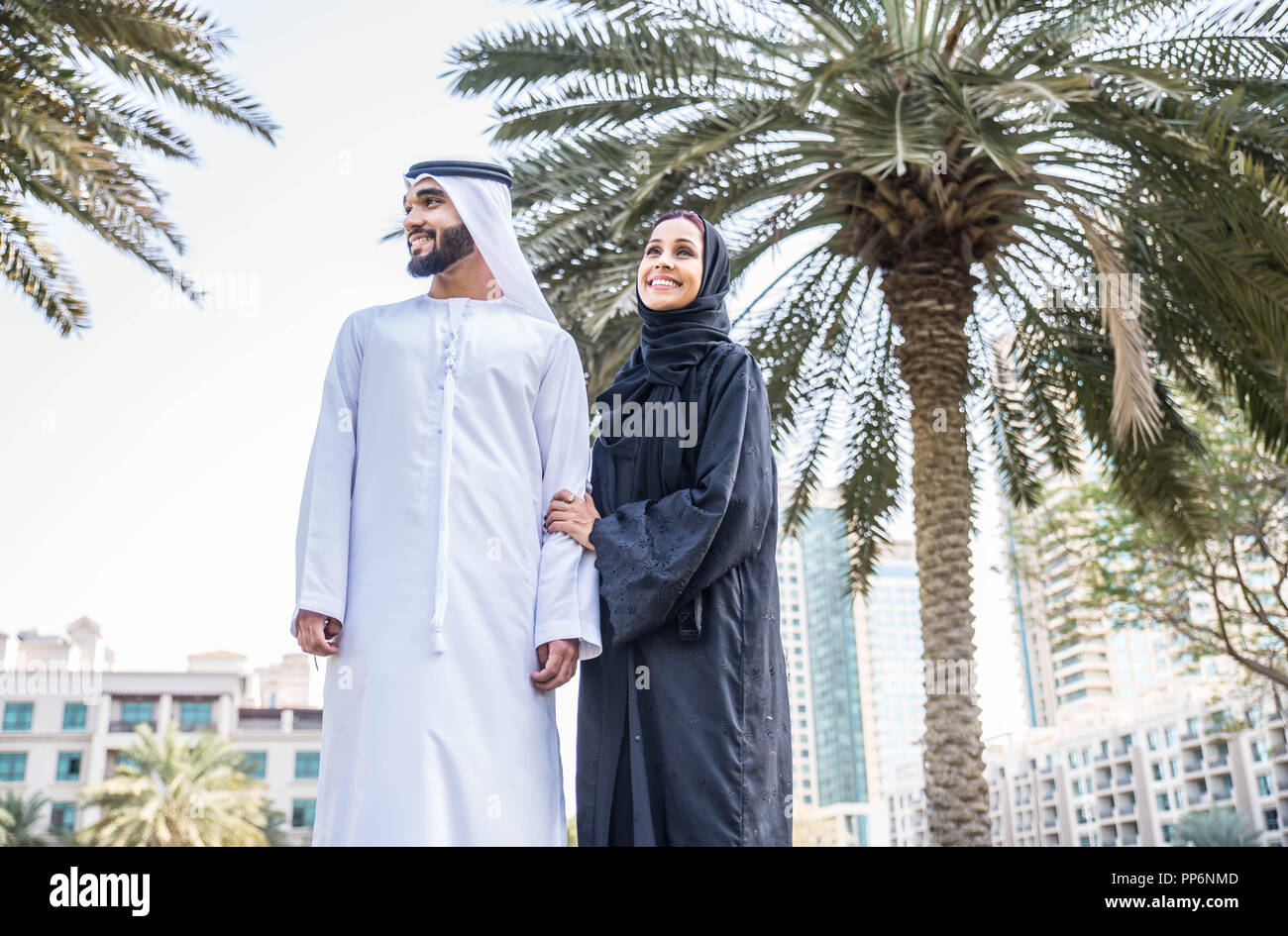 Arabic couple with traditional clothes dating outdoors Stock Photo - Alamy