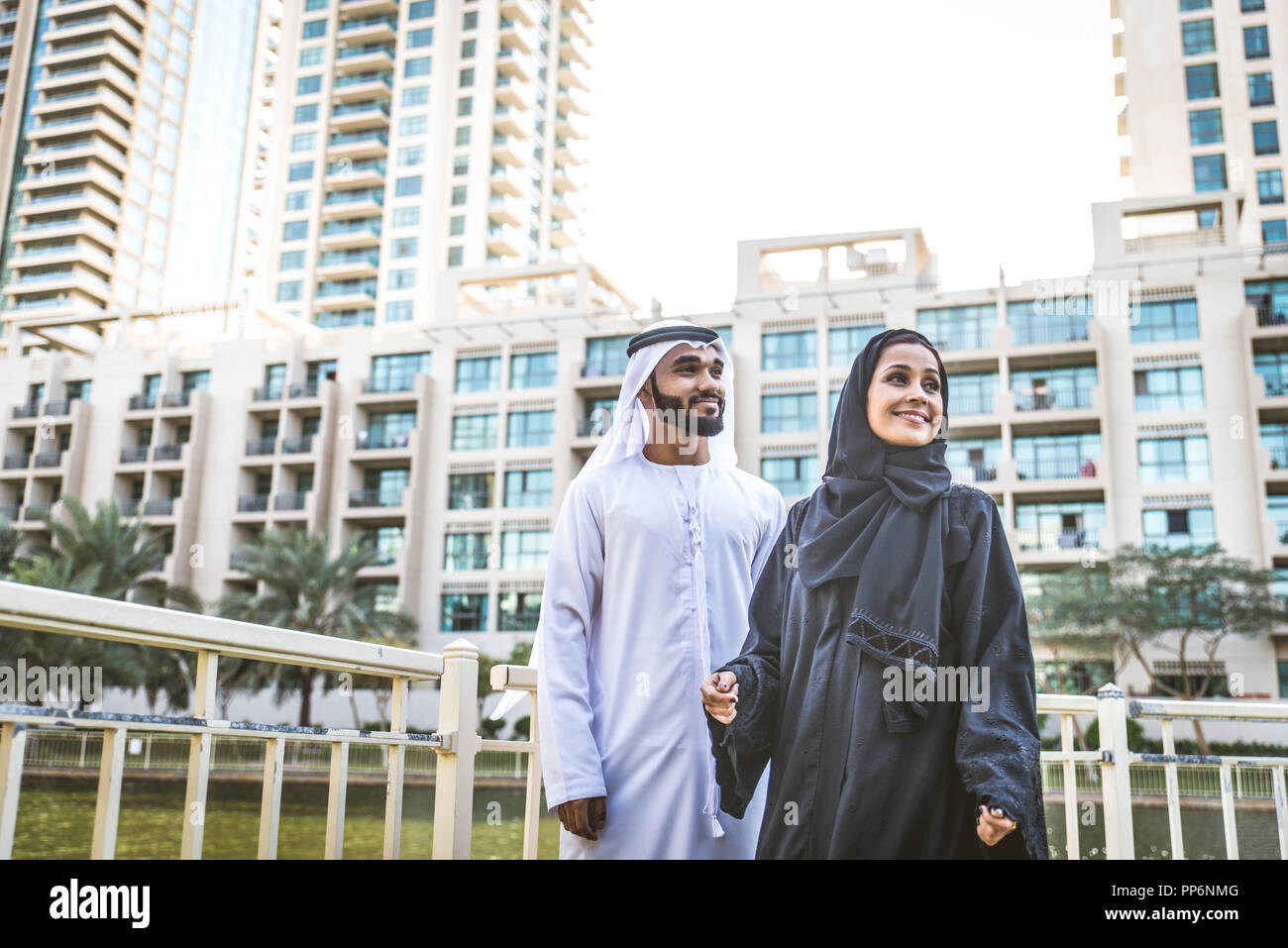 Arabic couple with traditional clothes dating outdoors Stock Photo - Alamy