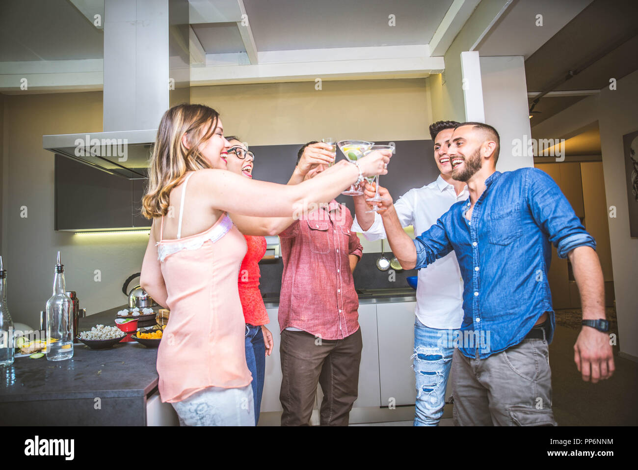 Friends having fun and making party at home Stock Photo - Alamy