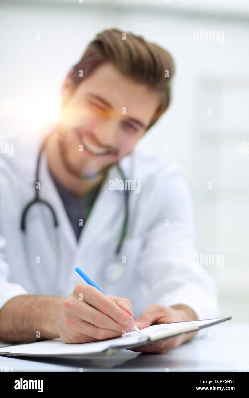background image of a doctor writing out a prescription Stock Photo - Alamy