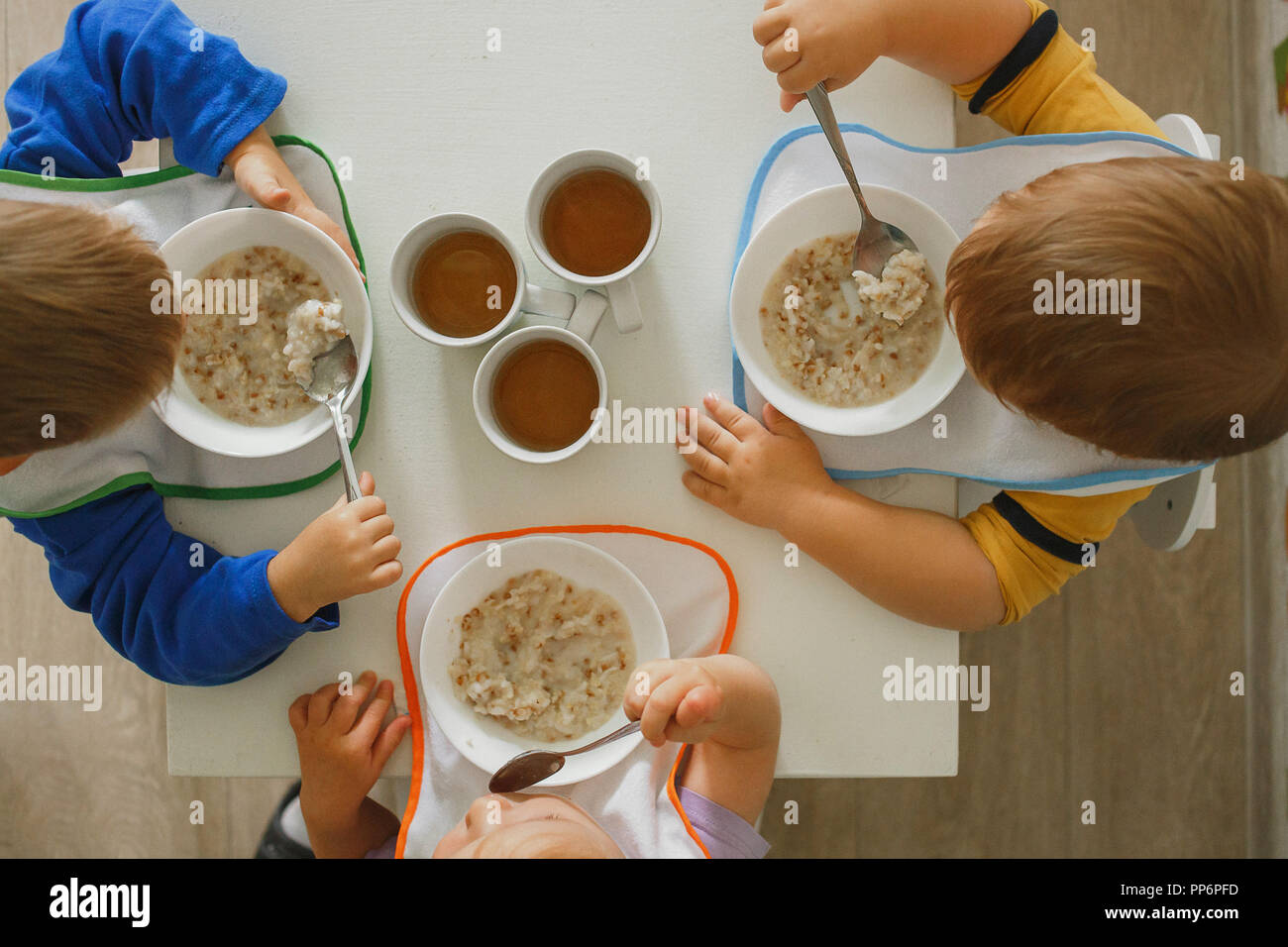 Preschool children eating breakfast in hi-res stock photography and ...