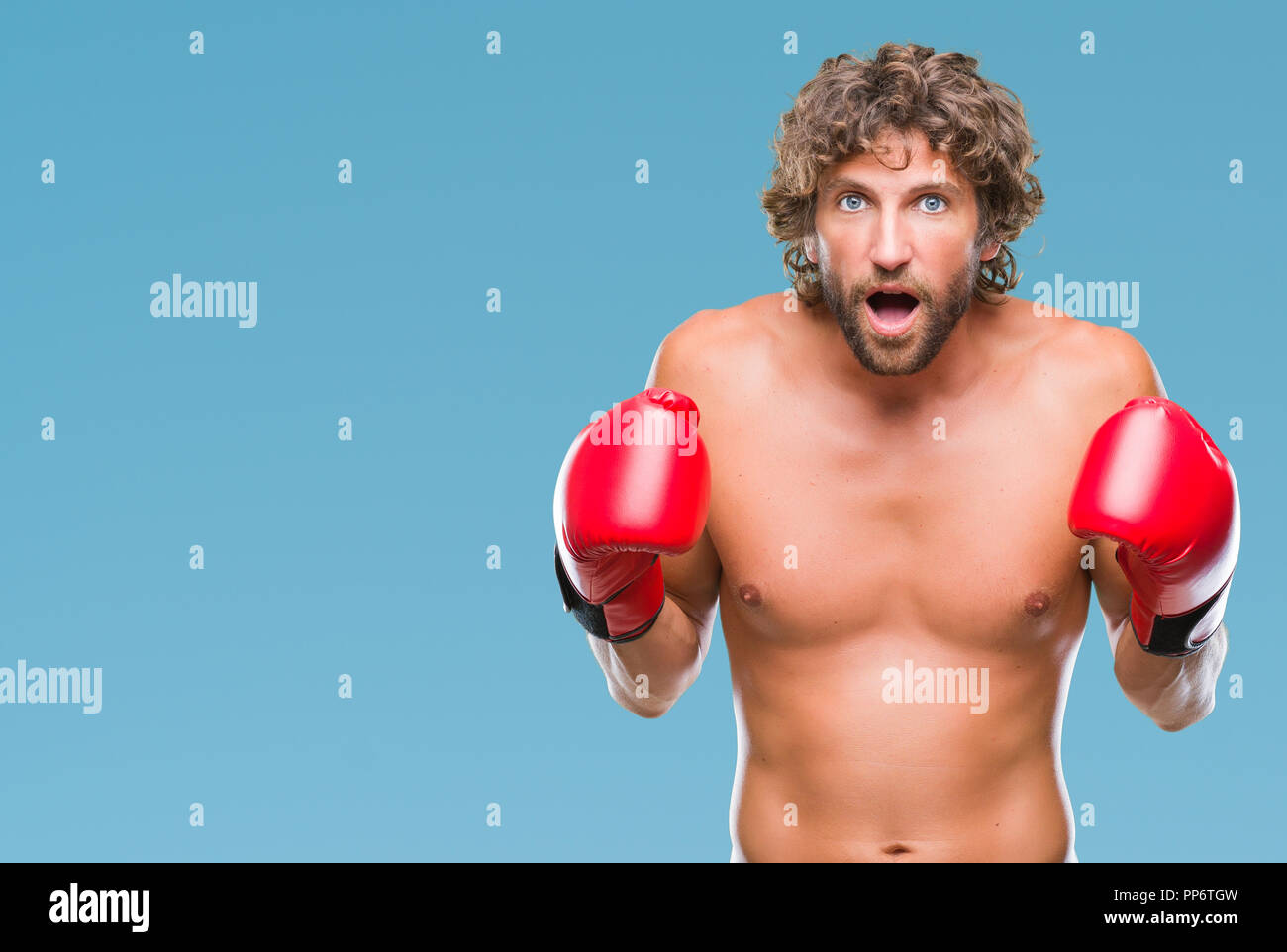 Handsome hispanic boxer man wearing boxing gloves over isolated ...