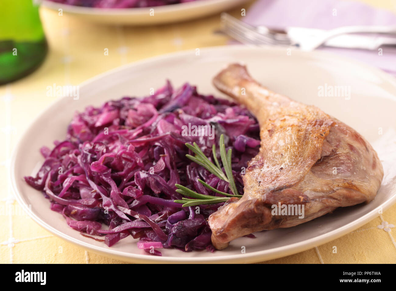 Roasted goose leg with braised red cabbage Stock Photo - Alamy