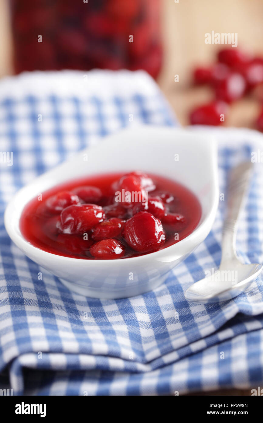 Cornelian cherry jam in the small bowl Stock Photo - Alamy
