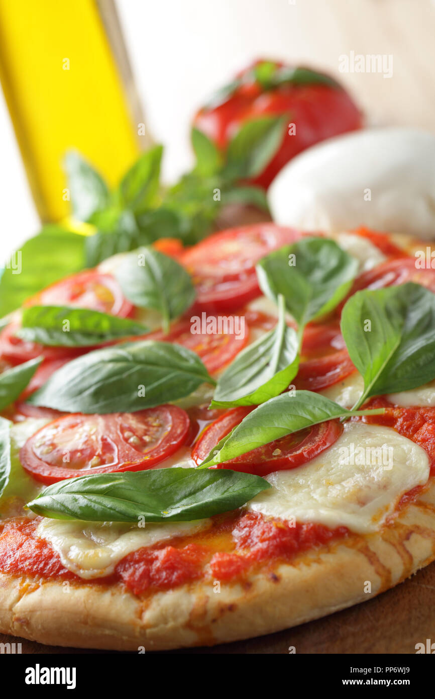 Margherita pizza with mozzarella, tomato, and basil Stock Photo - Alamy