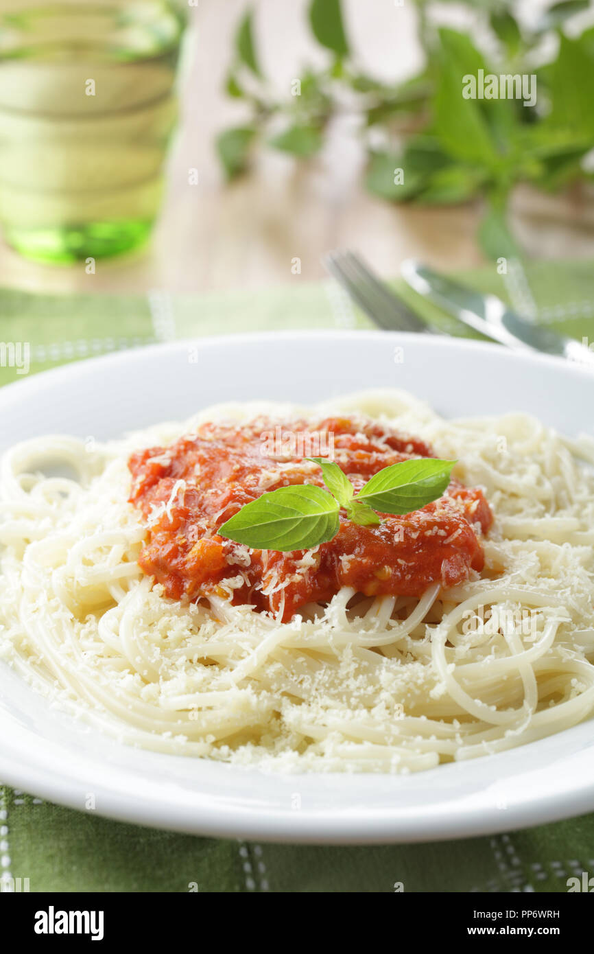 Spaghetti with salsa and shredded parmesan cheese closeup Stock Photo ...