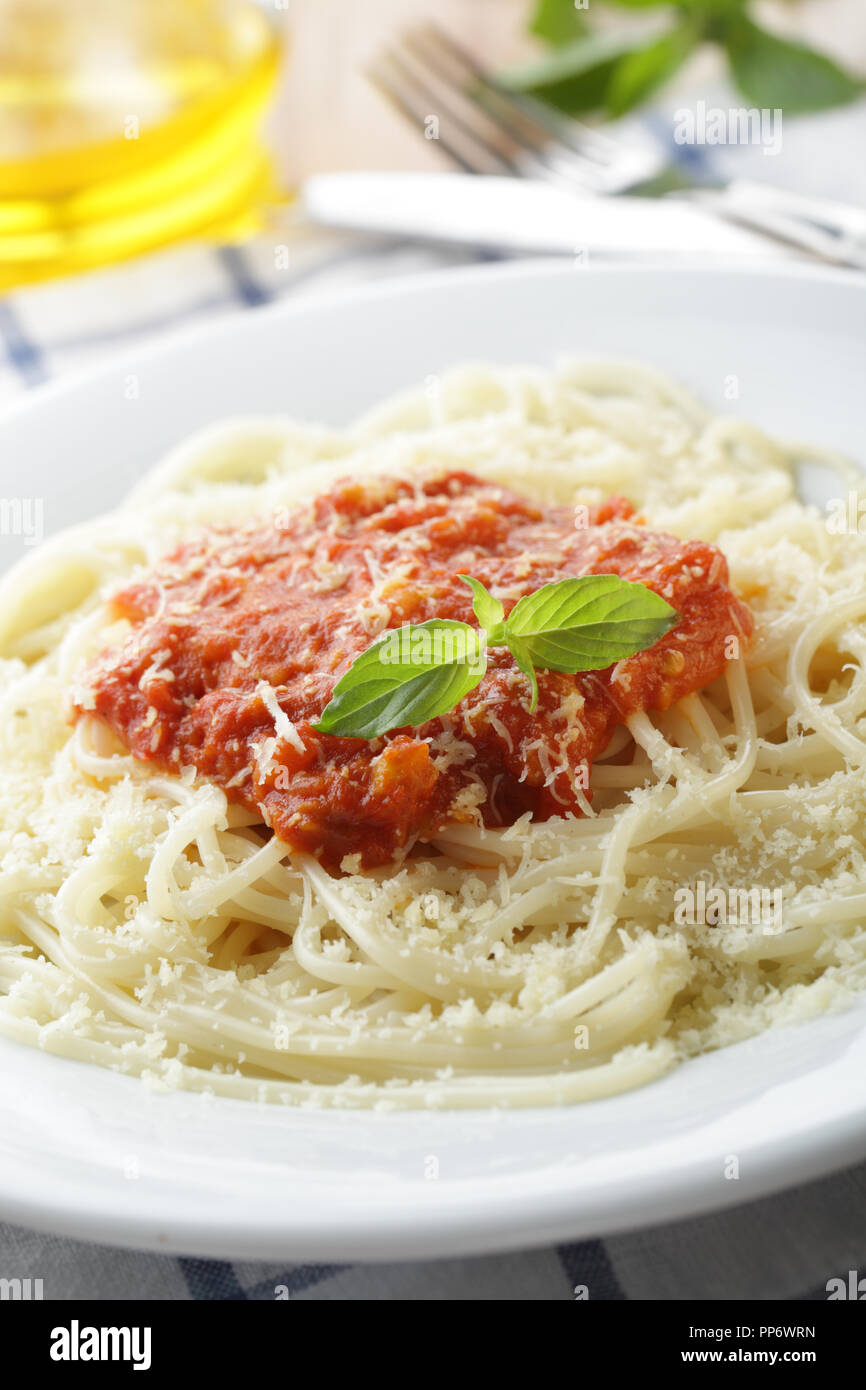 Spaghetti with salsa and shredded parmesan cheese closeup Stock Photo ...