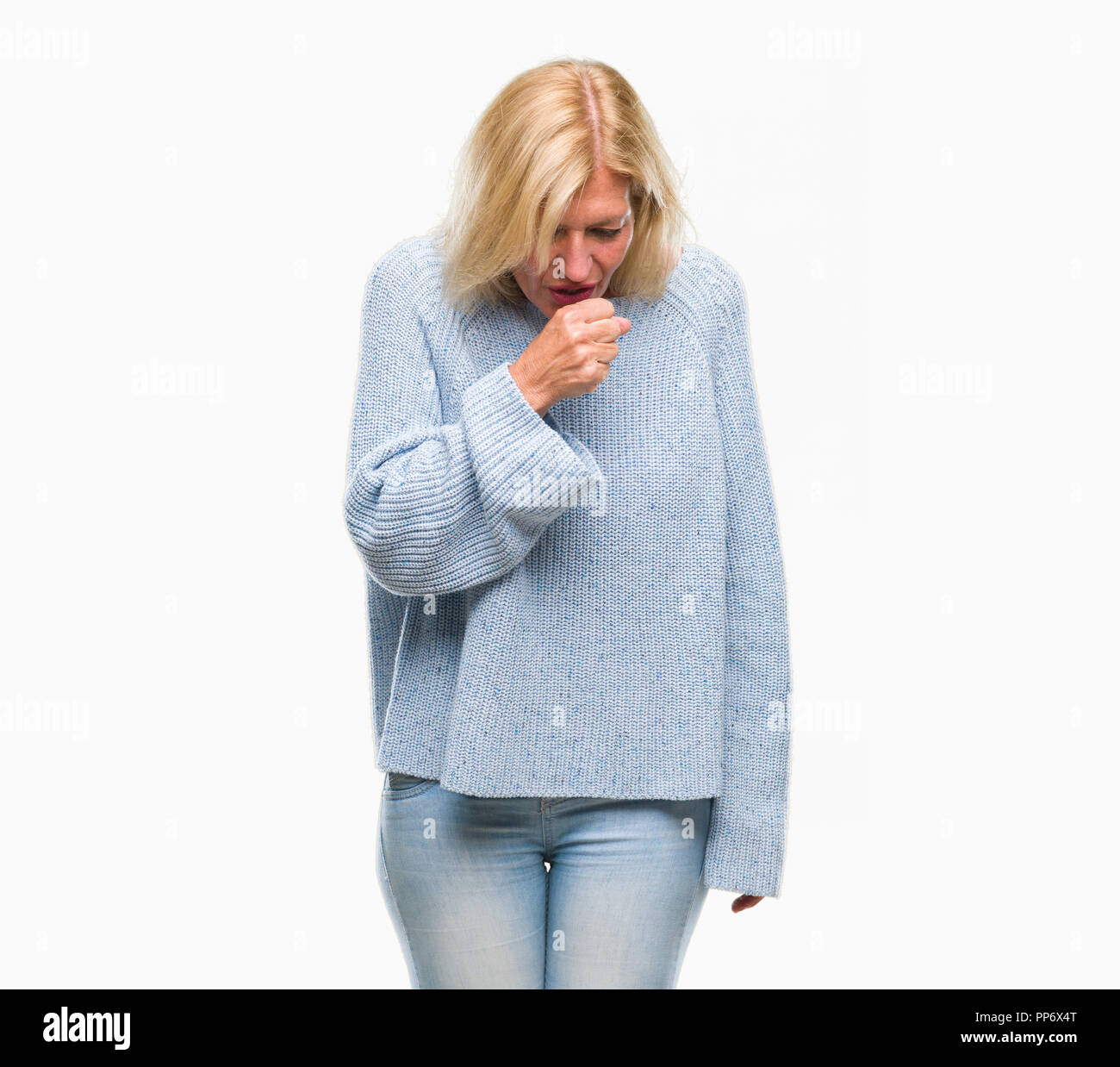 Middle age blonde woman wearing winter sweater over isolated background ...