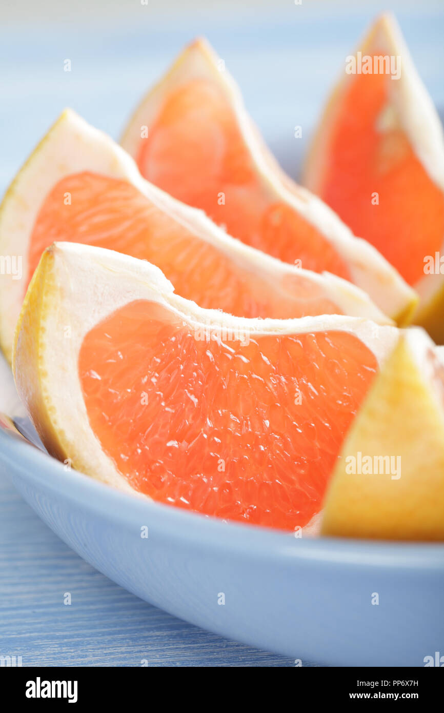 Grapefruit slices on blue hi-res stock photography and images - Alamy