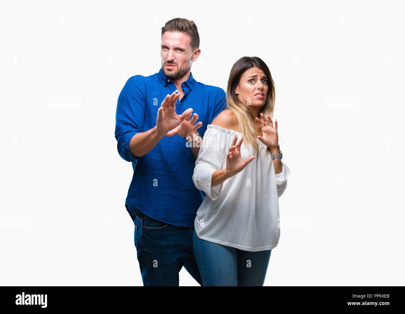 Young couple in love over isolated background disgusted expression ...