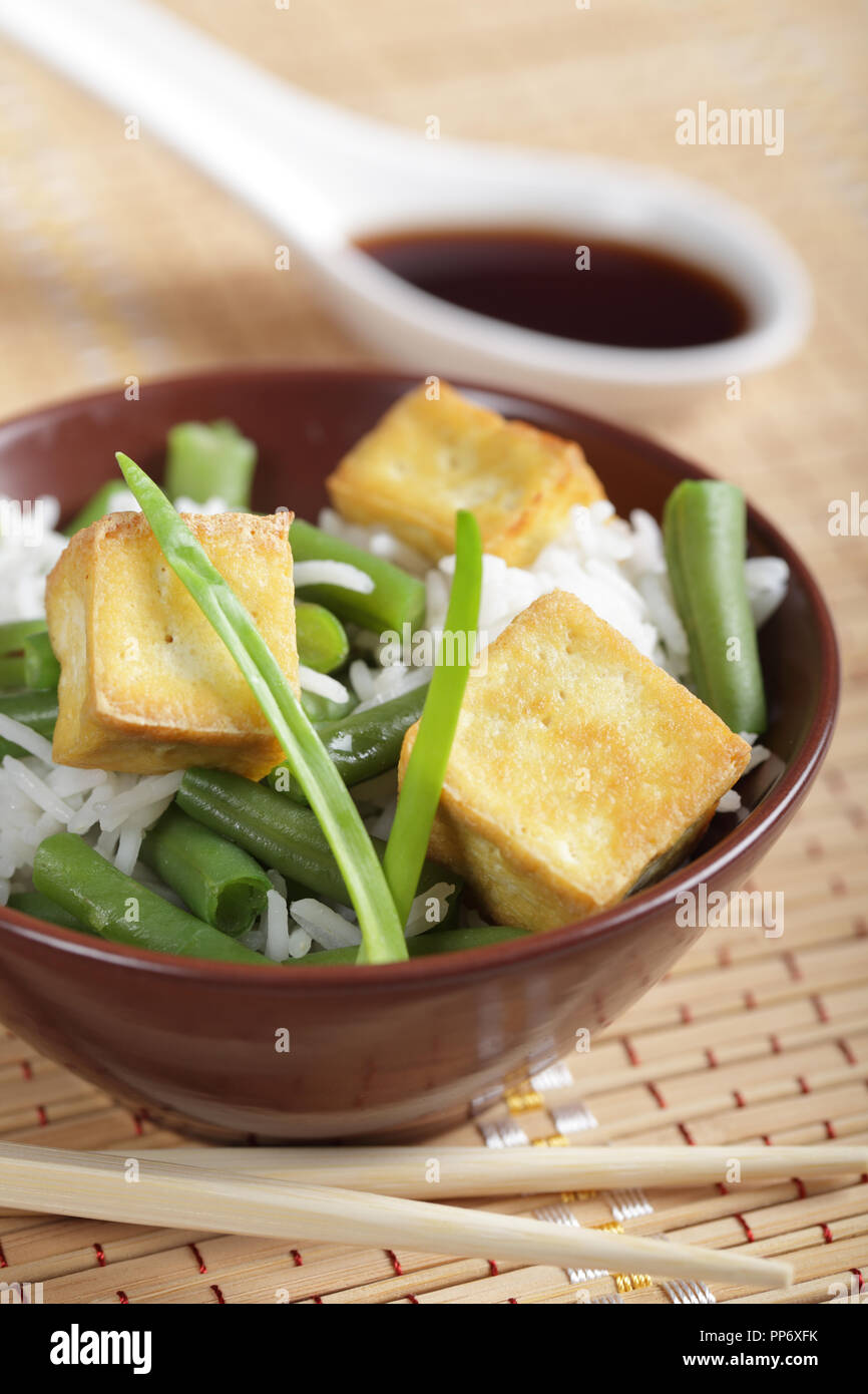 Fried tofu with rice, string bean, and soy sauce Stock Photo - Alamy