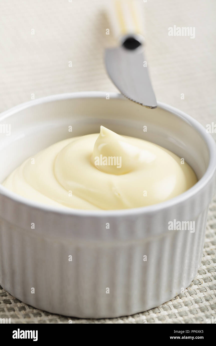 Mayonnaise in the bowl closeup Stock Photo - Alamy