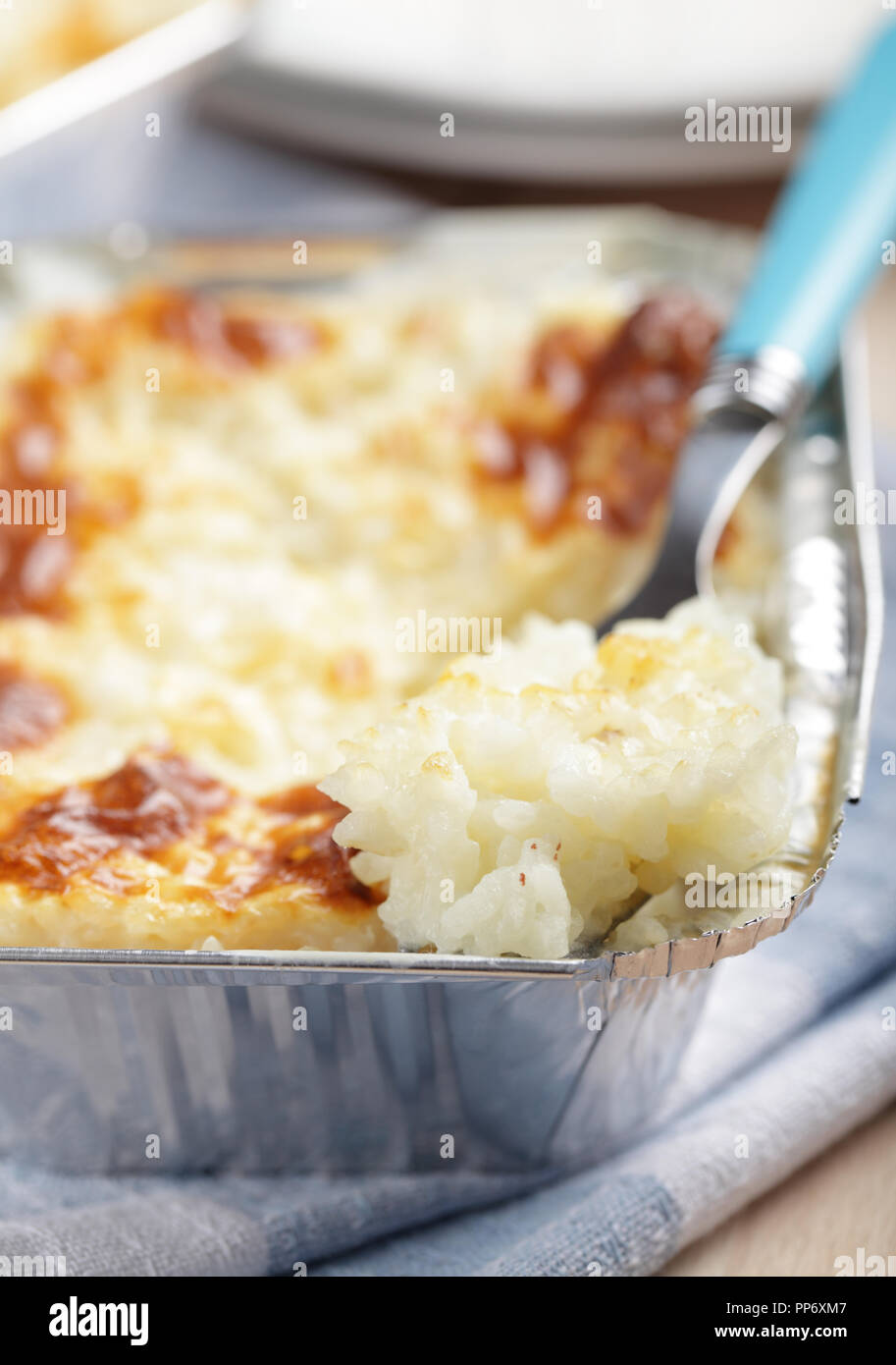 Rice pudding in the disposable aluminum baking pan Stock Photo - Alamy