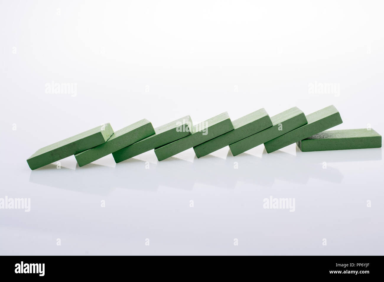 Colorful Domino Blocks in a line on a white background Stock Photo - Alamy