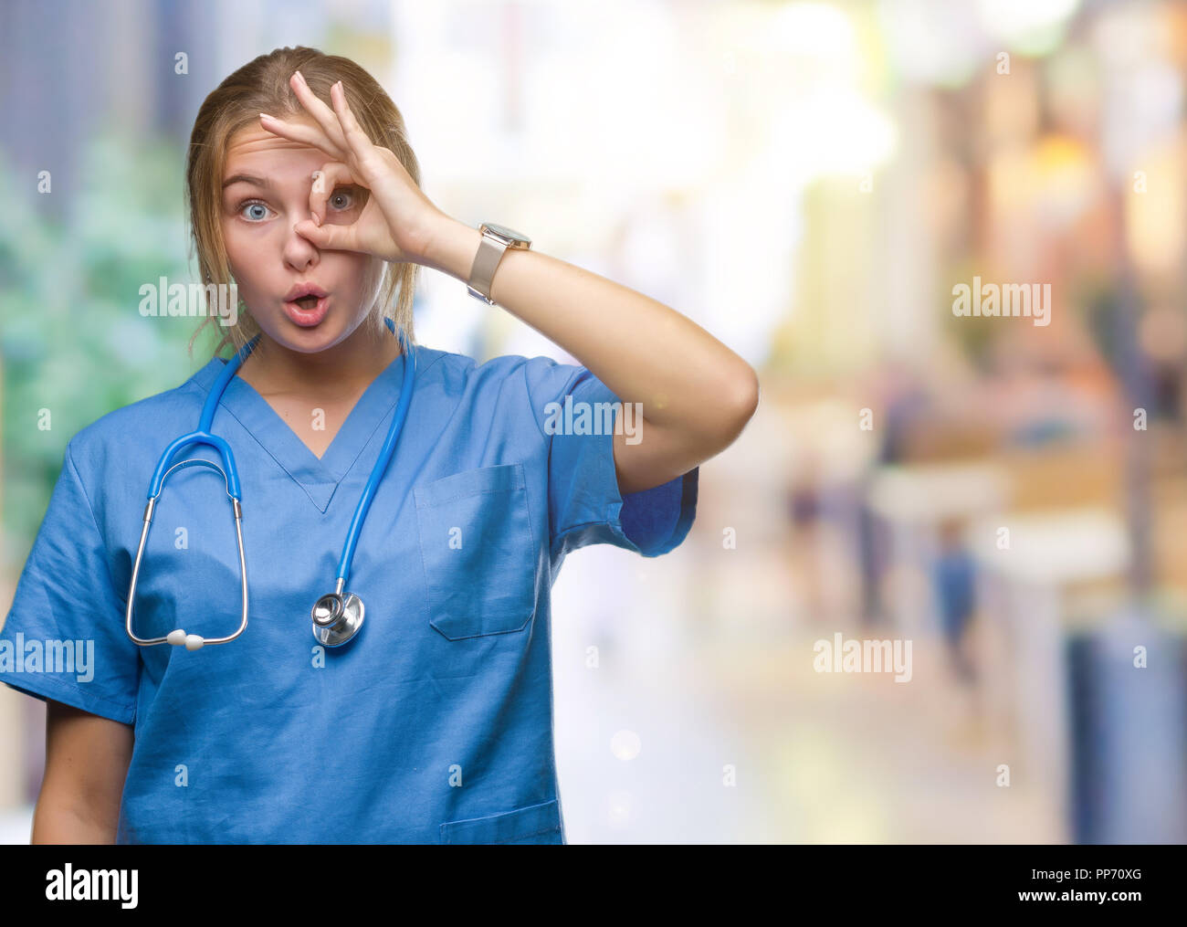 Young caucasian doctor woman wearing surgeon uniform over isolated ...