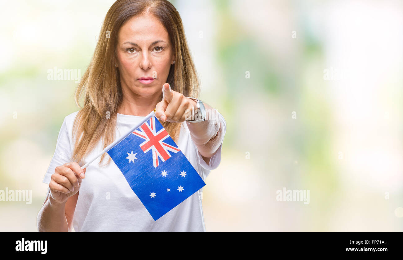 Middle age hispanic woman holding flag of Australia over isolated ...