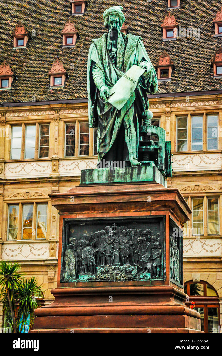 The statue of Gutenberg in Place Gutenberg, surrounded by traditional ...