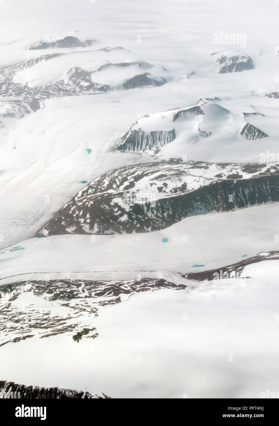 Aerial view of Greenland, glaciers, glacial melt, ice flows and blue ...