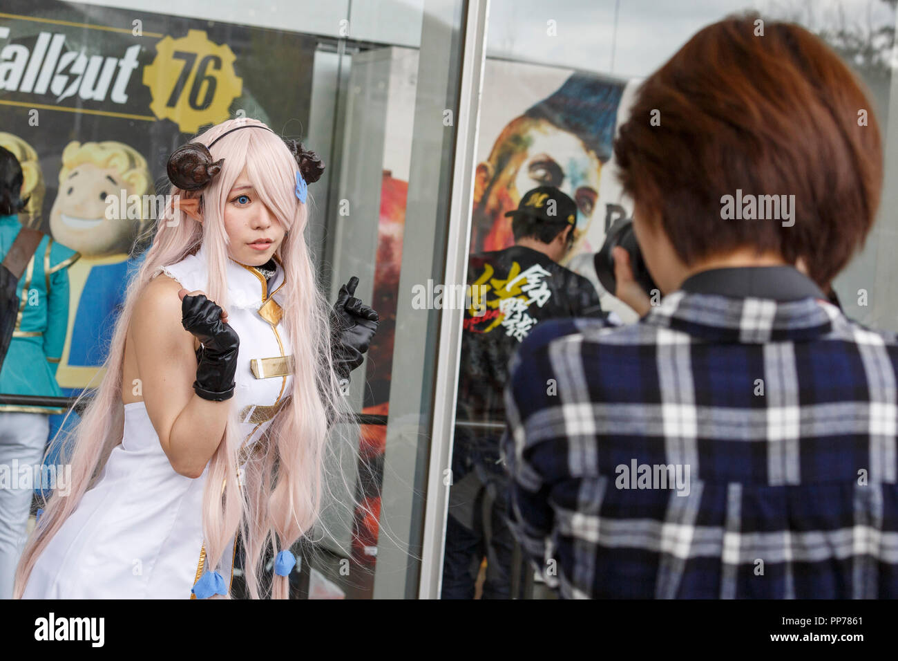 A cosplayer poses for a photographer during the Tokyo Game Show (TGS ...