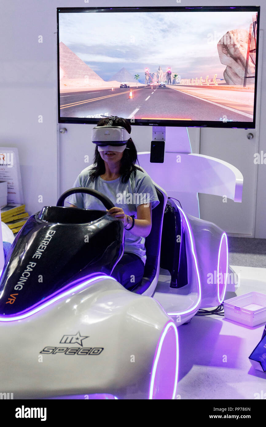 A visitor enjoys testing a VR (Virtual Reality) video game during the ...