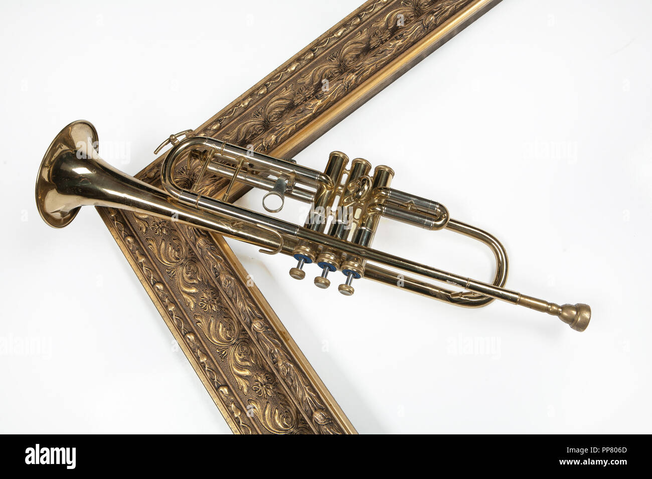 Trumpet and golden frame on an isolated studio background Stock Photo ...