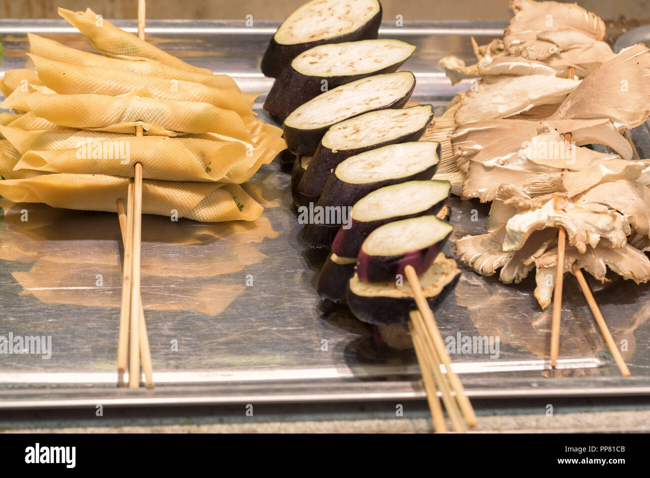Street food asia. Street food on a stick Stock Photo - Alamy