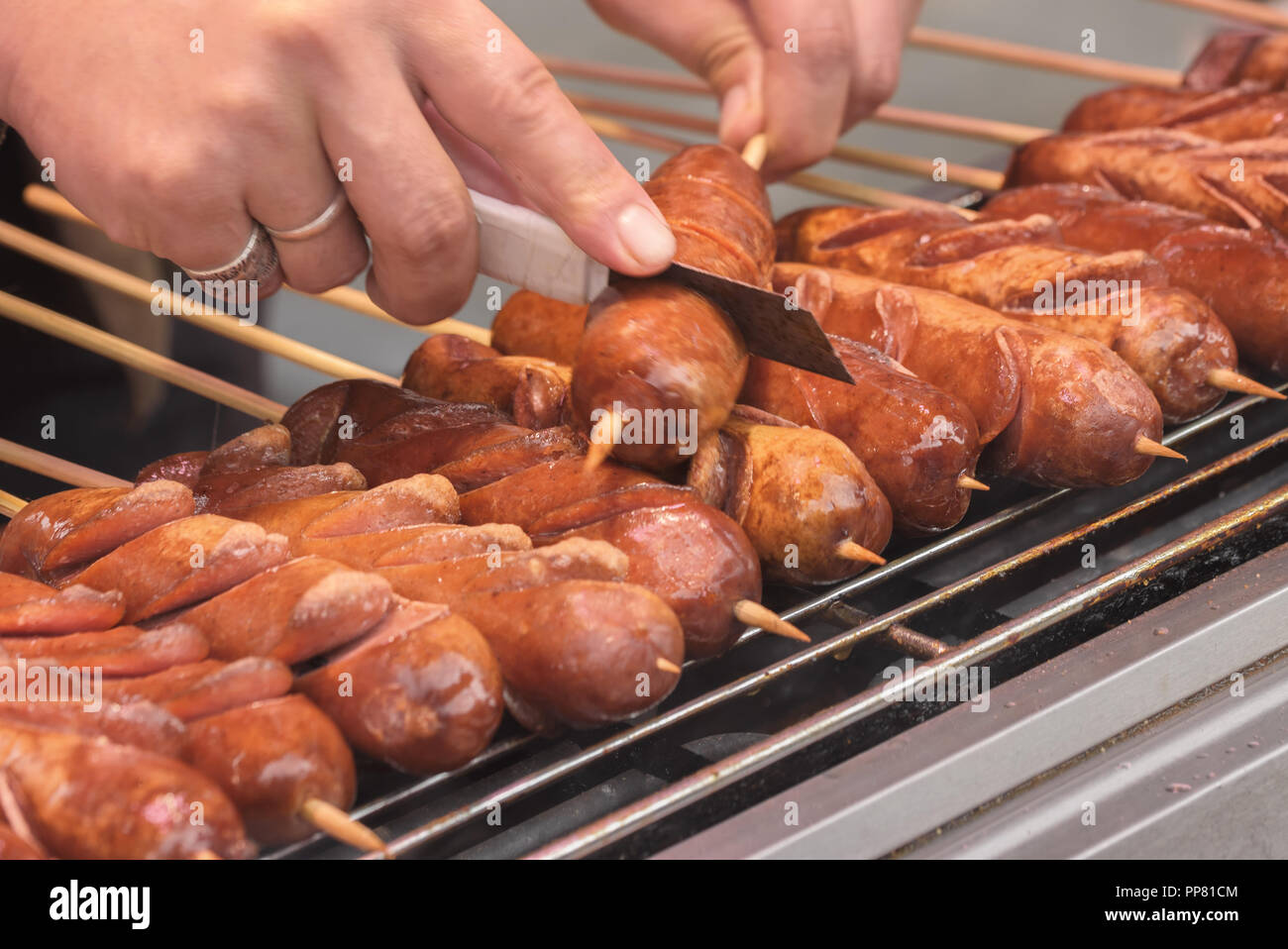 Street food asia. Sausages on a stick. Chinese street food Stock Photo ...