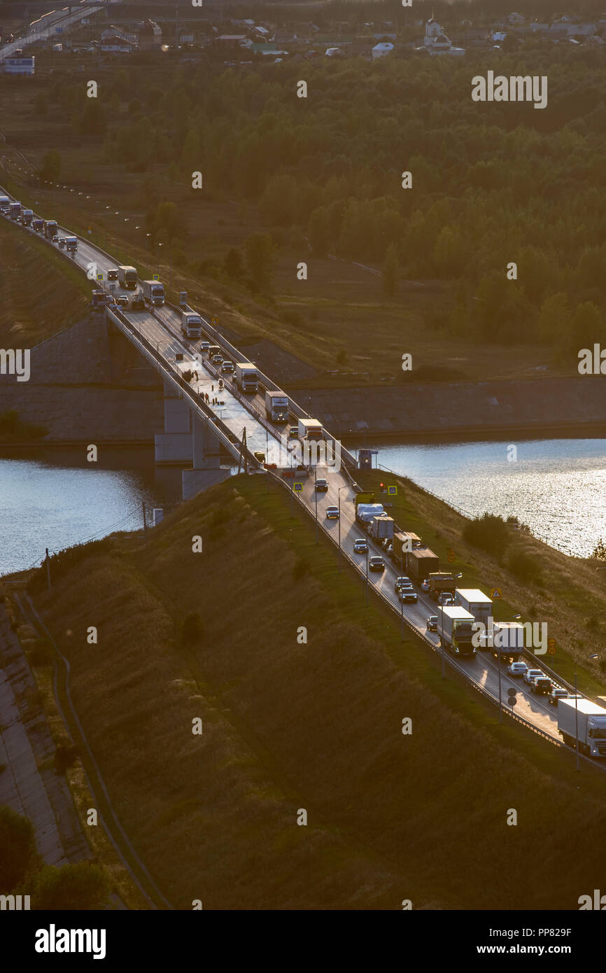 Stream of cars on sunset , car traffic, vertical Stock Photo - Alamy
