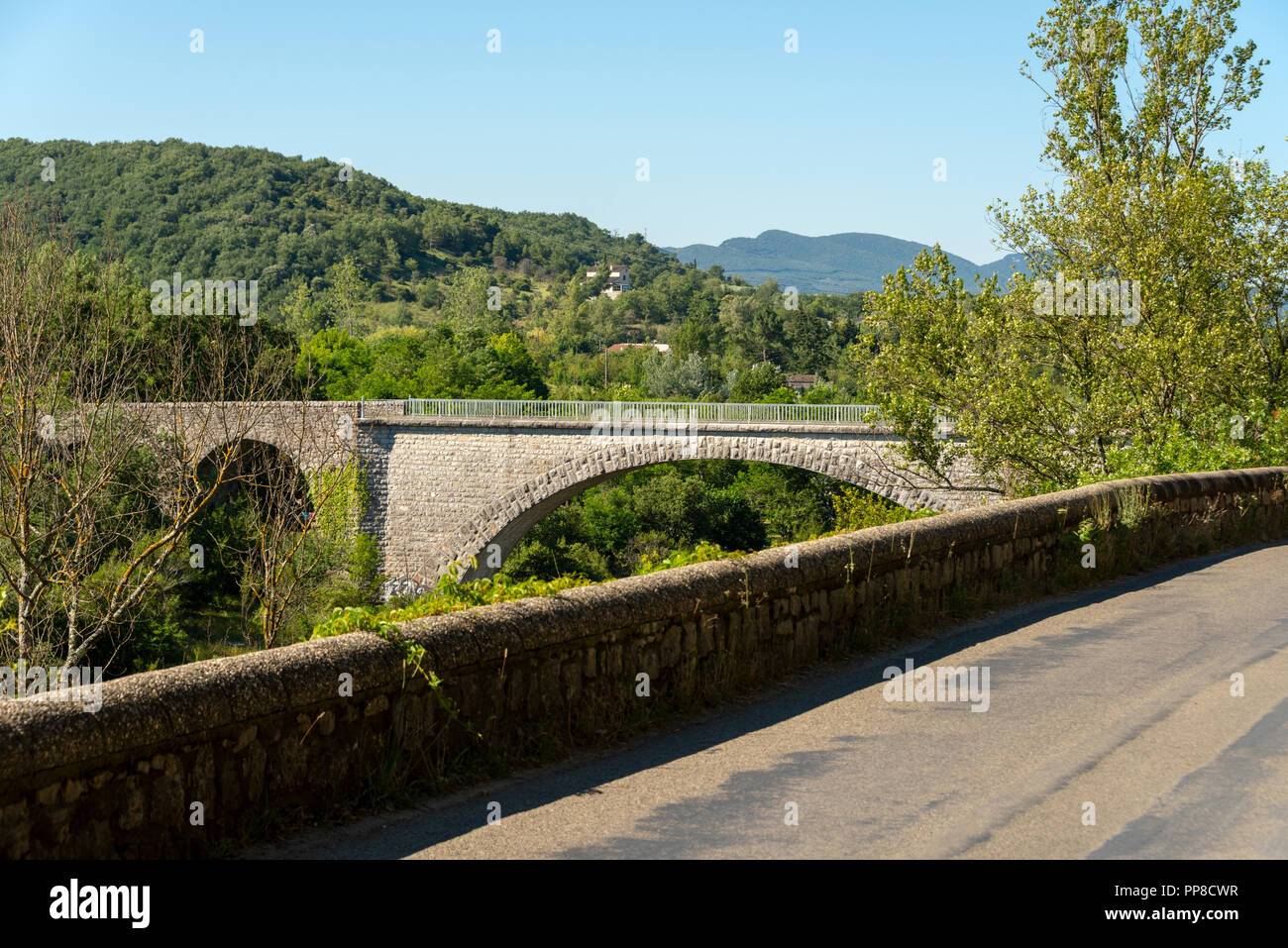 Stone bridge over the river Ardeche near Pradons in the department ...