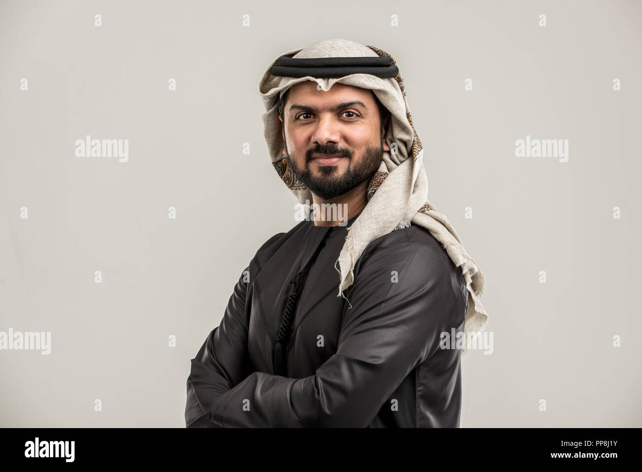 Portrait of arabic man with kandora in a studio Stock Photo - Alamy