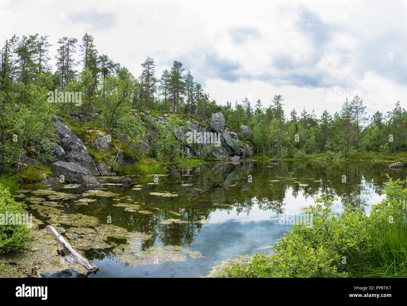 A beautiful small lake in a rocky coast on a summer day, Karelia ...