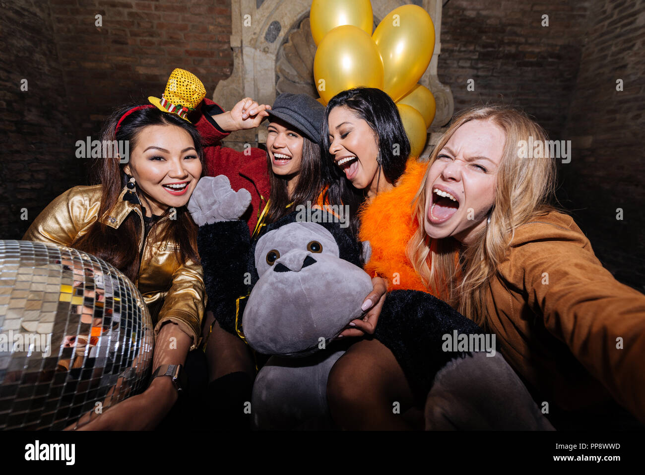 Group of happy girls having party in a club - Four young women having a ...