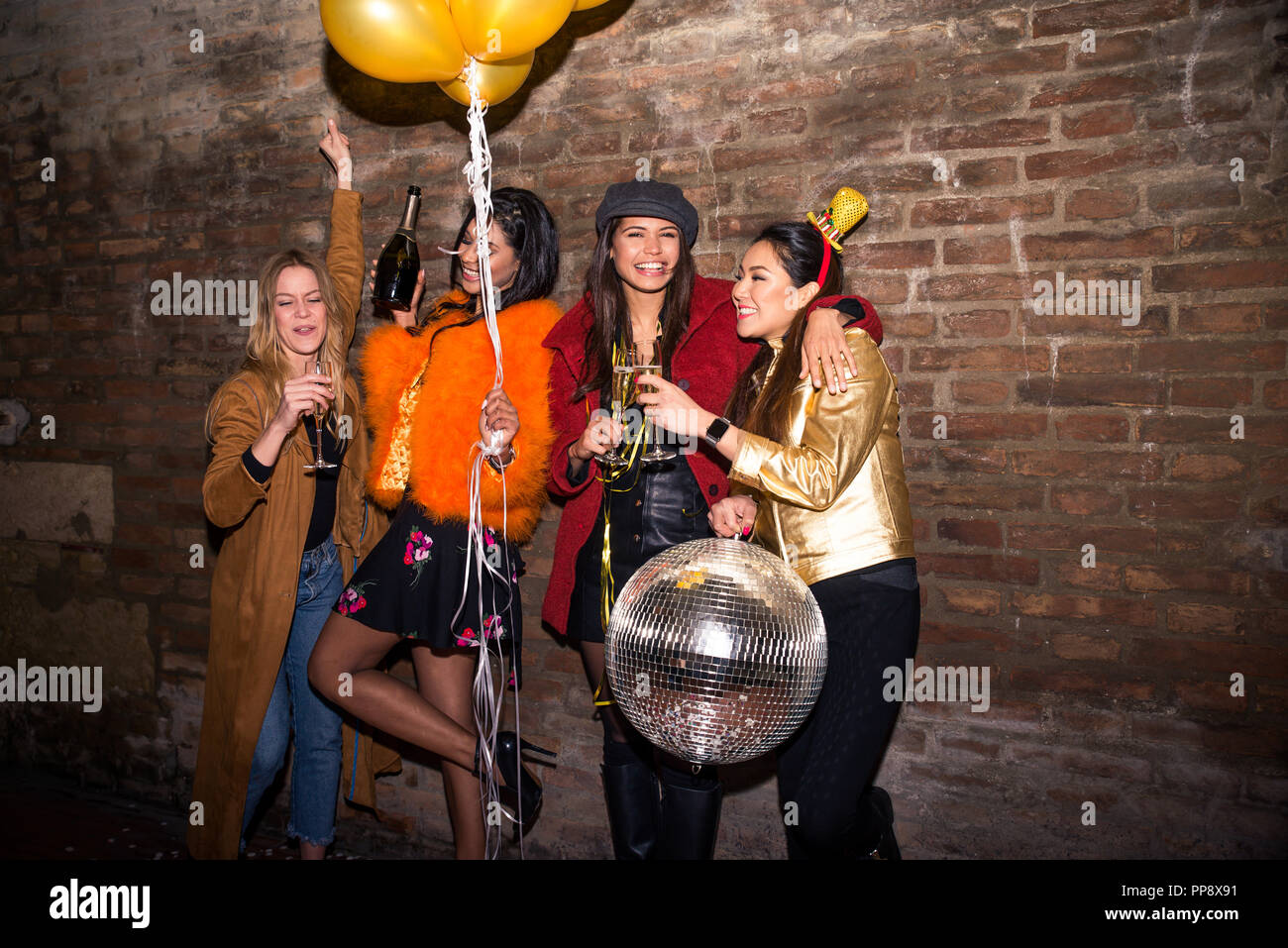Group of happy girls having party in a club - Four young women having a ...