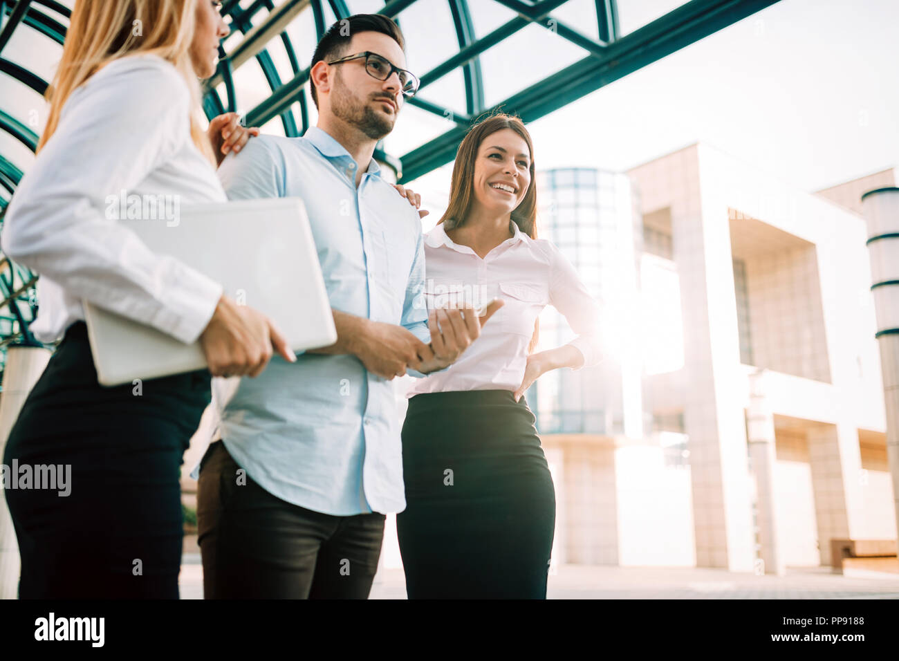 Business woman and male colleagues hi-res stock photography and images ...