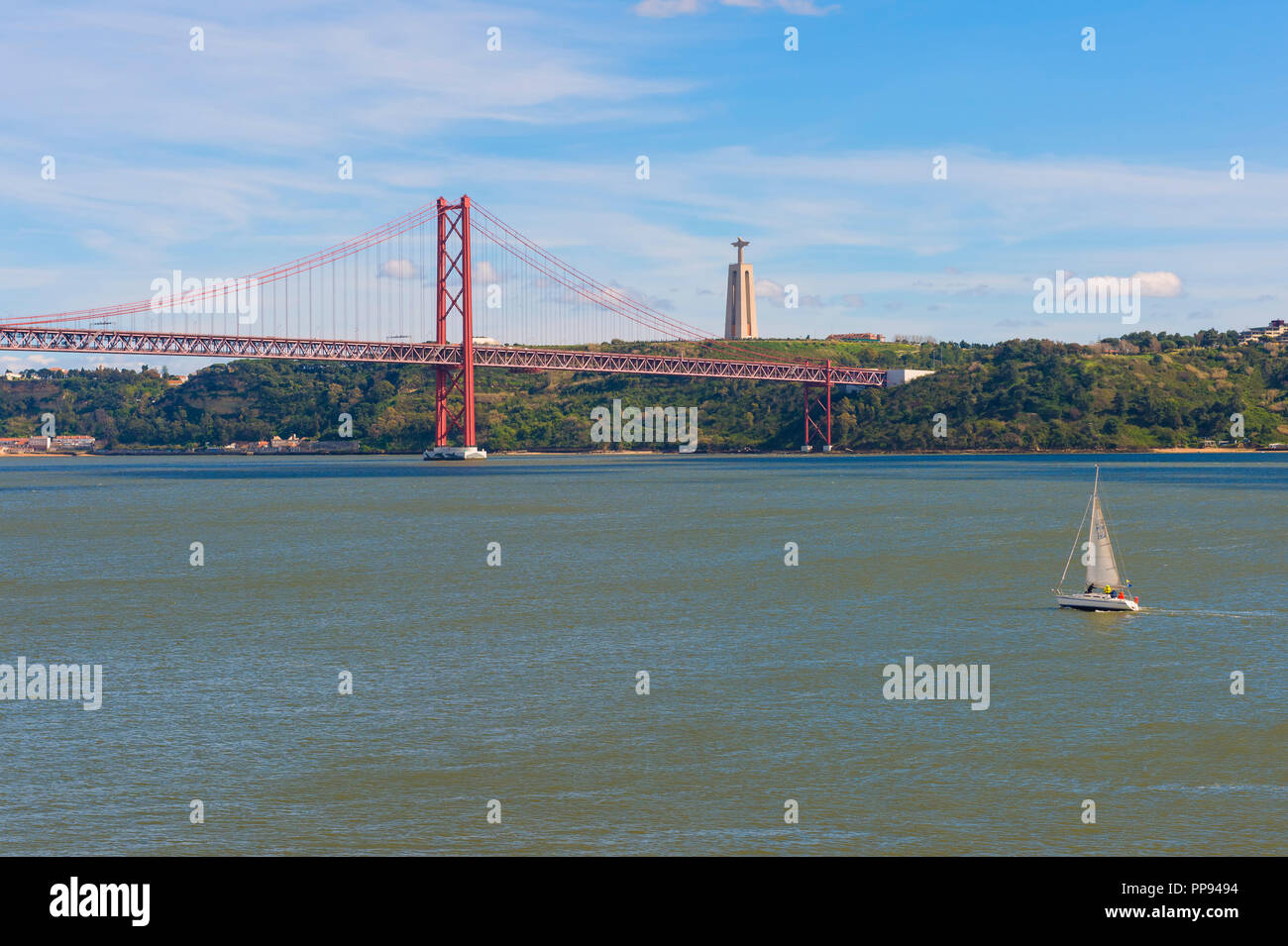 25 April Bridge, former Salazar bridge, over the Tagus river and Cristo ...