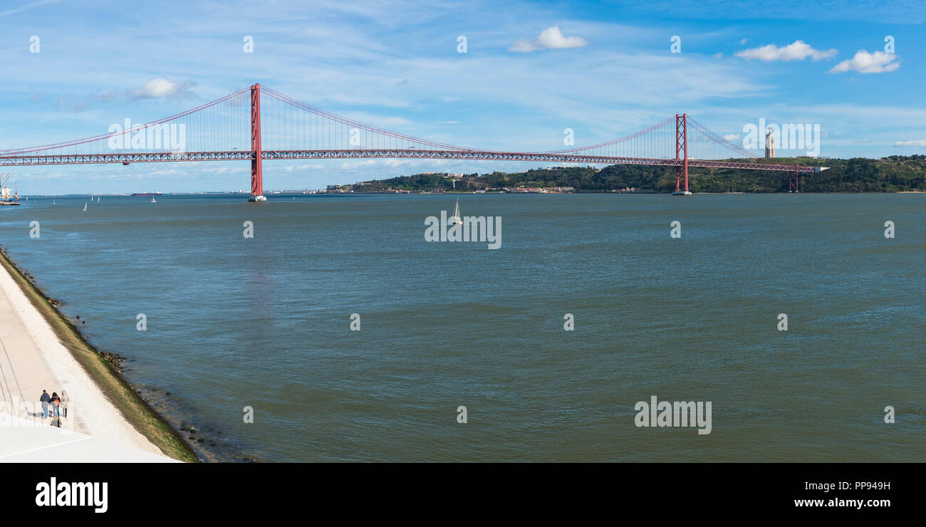 25 April Bridge, former Salazar bridge, over the Tagus river and Cristo ...
