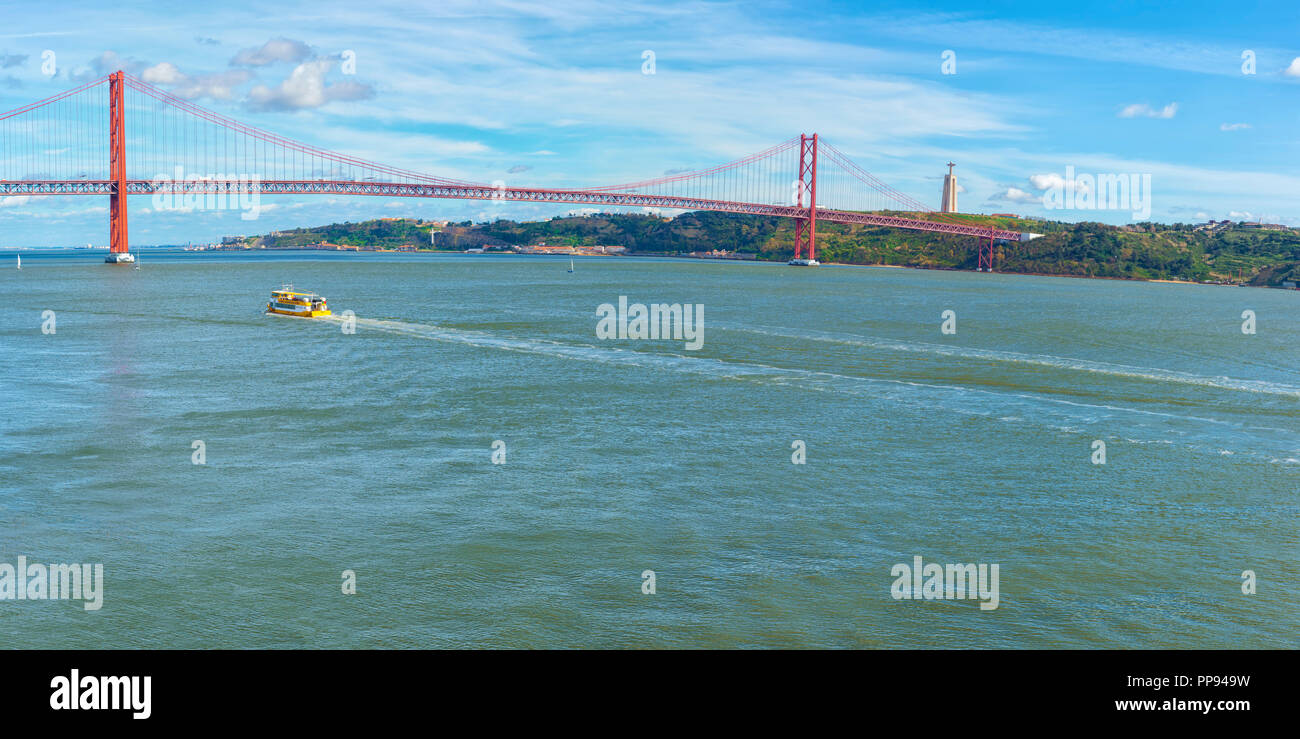 25 April Bridge, former Salazar bridge, over the Tagus river and Cristo ...