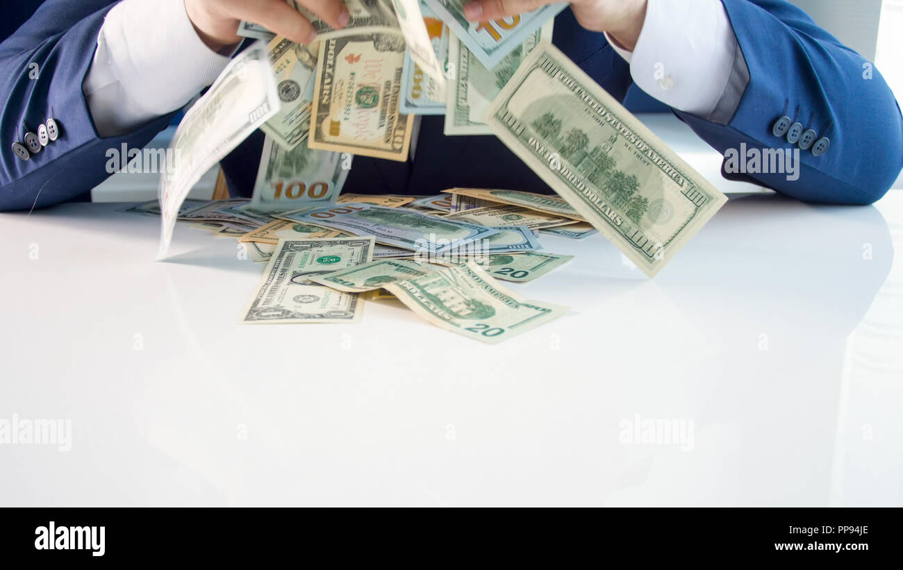 Businessman throwing money debt hi-res stock photography and images - Alamy